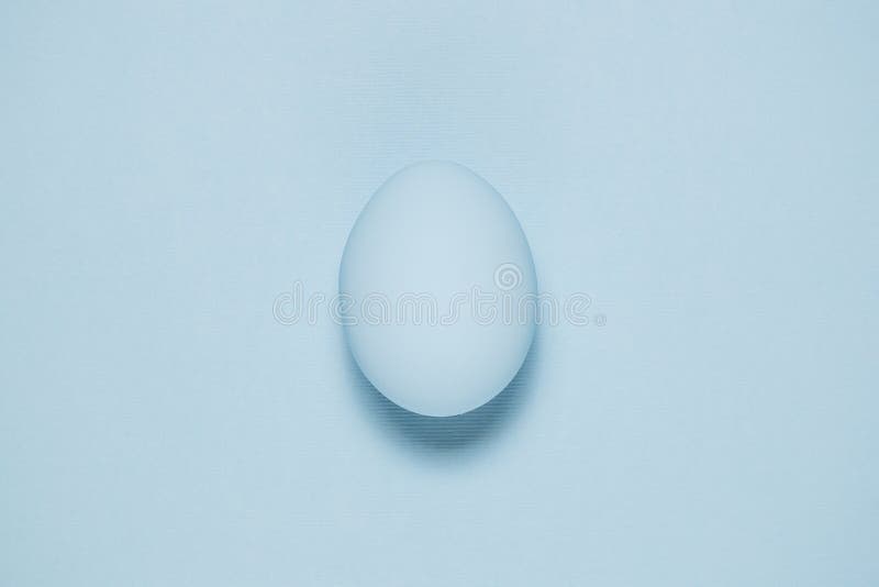 Blue Egg on Blue Background Stock Photo - Image of custom, color: 110457996