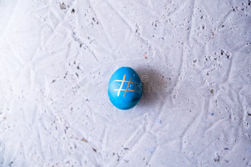 Blue Egg with Hashtag Pattern on Concrete Surface Stock Image - Image ...