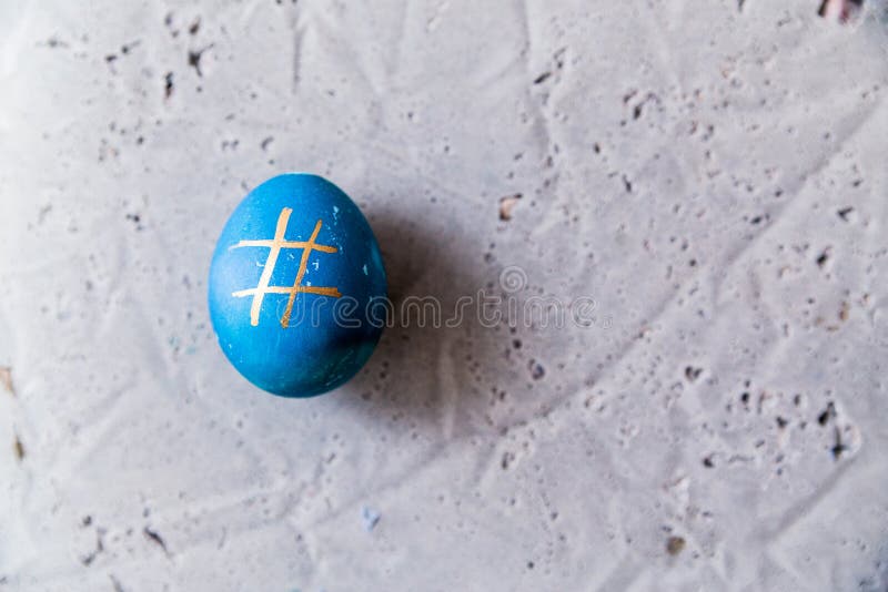 Blue Egg with Hashtag Pattern on Concrete Surface Stock Image - Image ...