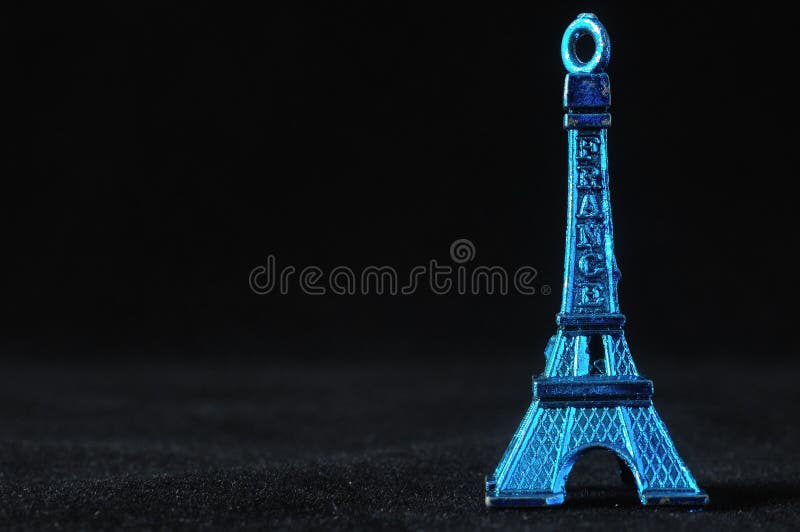Blue Eiffel Tower Statuette on a Black Background Stock Photo - Image ...