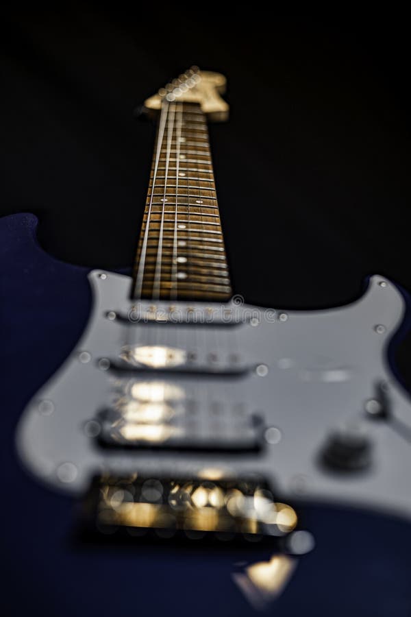 Blue Electric Guitar in Vertical Stock Photo - Image of stage, concert ...