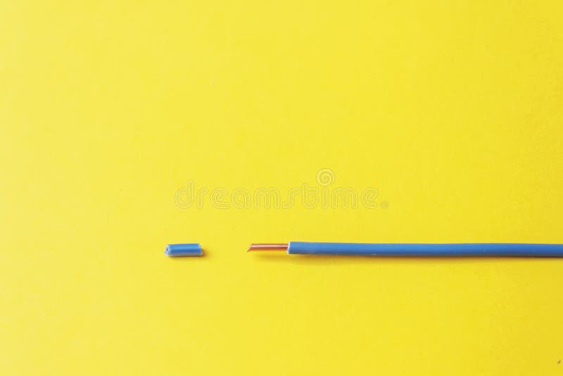 Blue Electrical Wire Stripped of Insulation on One Side on a Yellow ...