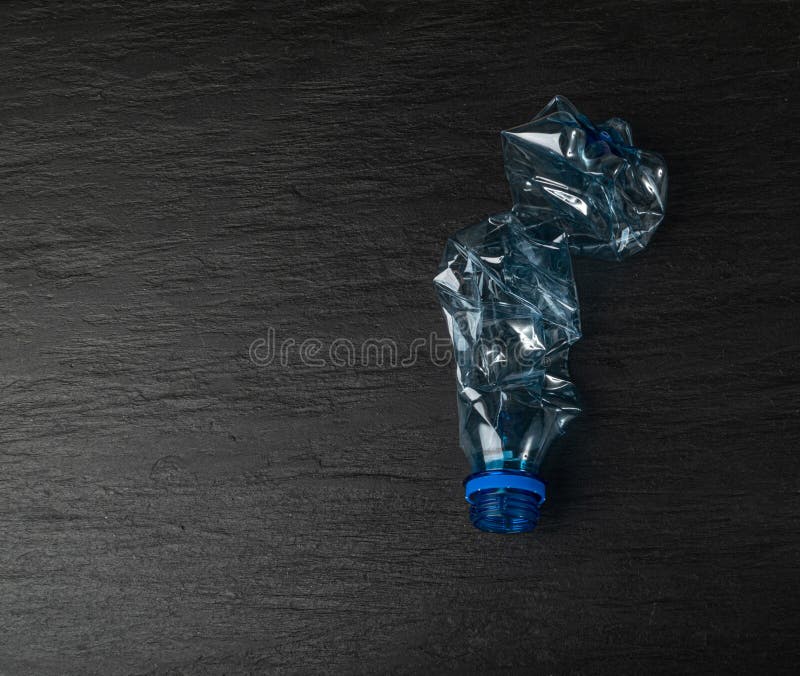 Blue Empty Plastic Bottle on Black Background, Crumpled Plastic Bottle ...
