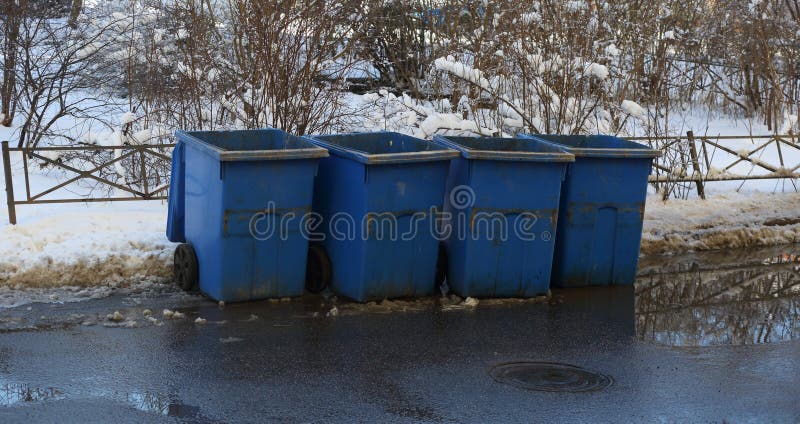 Blue Empty Plastic Mobile Garbage Containers Stand on the Asphalt Near ...