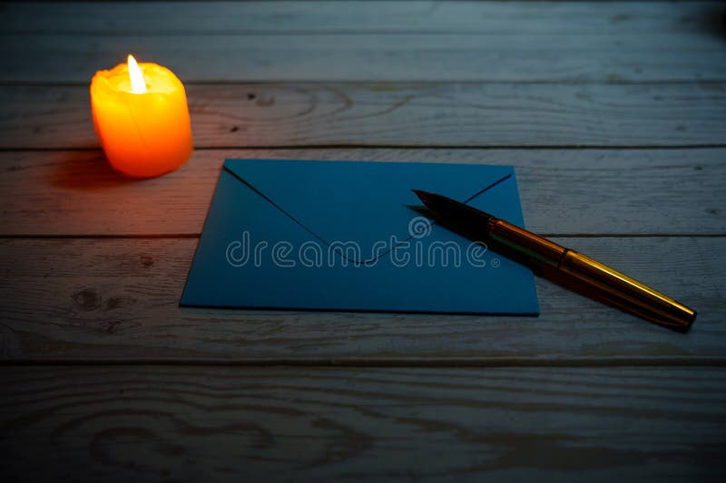 A Blue Envelope with a Gold Handle in the Candlelight Stock Image ...