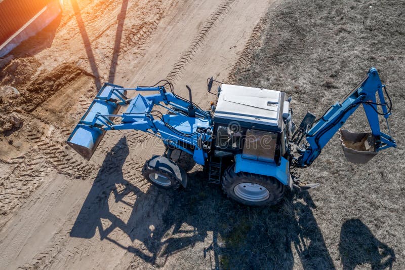 The Blue Excavator Has Black Smoke Produced by Incomplete Combustion ...