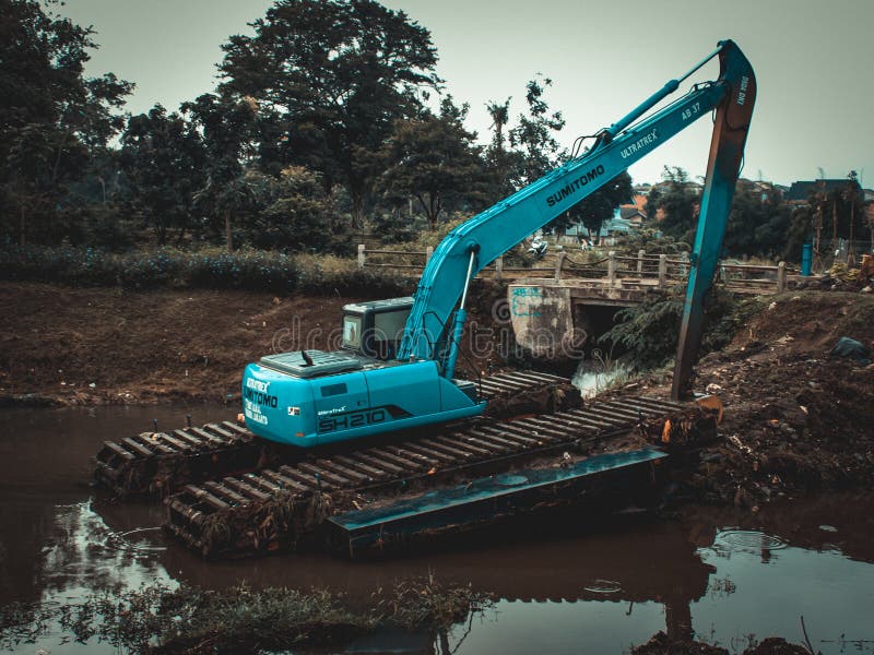 Blue Excavator in Construction Site Editorial Image - Image of ...