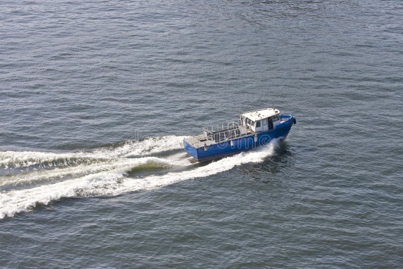 Blue Excursion Boat Cutting through Bay Stock Photo - Image of boat ...