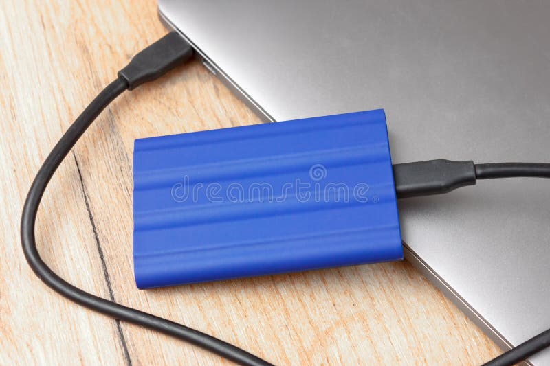 Blue External Hard Drive Connected To a Laptop. Stock Image - Image of ...