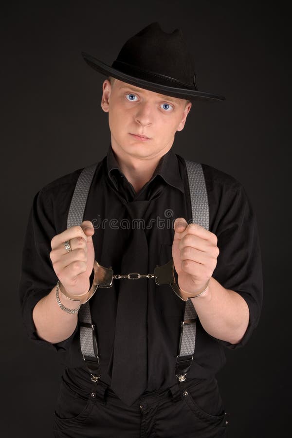 Blue-eyed gangster busted stock photo. Image of eyes - 16124514