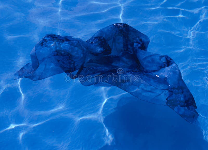 Red Fabric Floating in Pool Stock Image - Image of lookup, rainy: 112519861