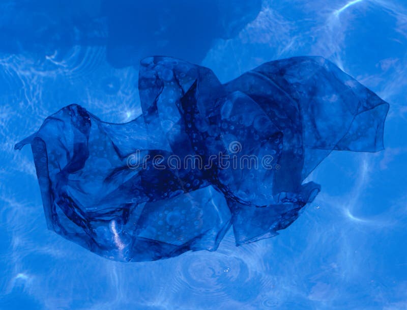 Red Fabric Floating in Pool Stock Image - Image of lookup, rainy: 112519861