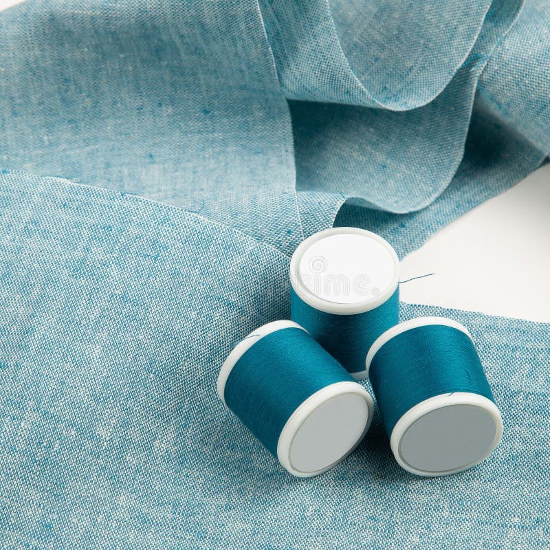 Blue Fabric with Spool of Sewing Thread Stock Photo - Image of clothes ...