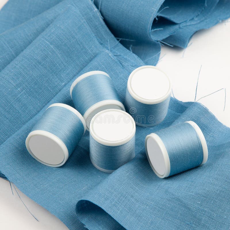 Blue Fabric with Spool of Sewing Thread Stock Photo - Image of needle ...