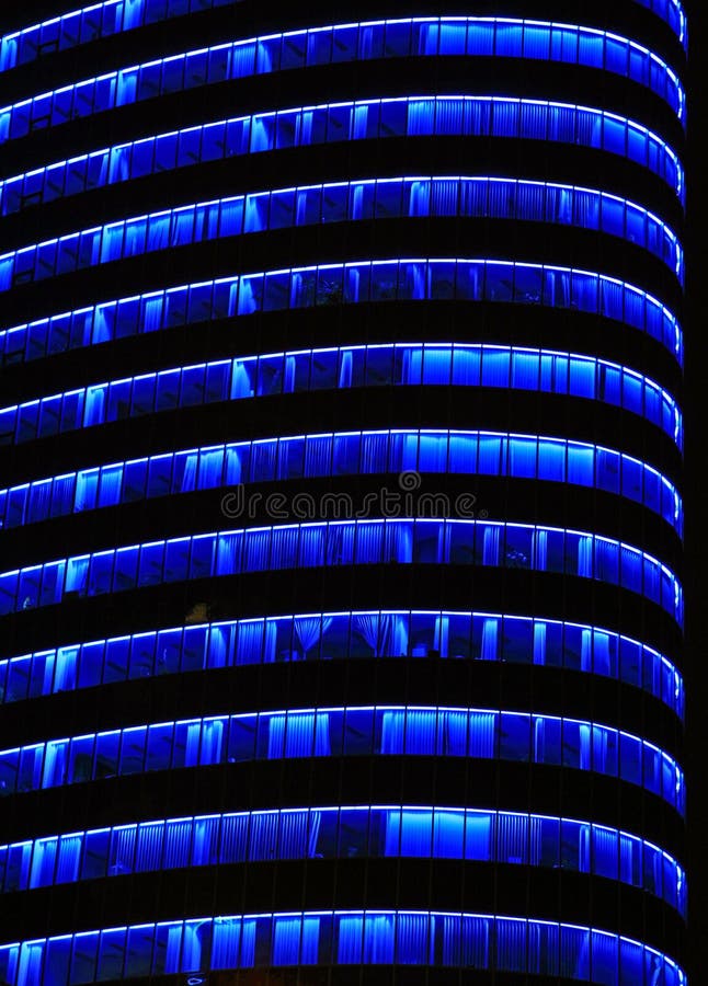 Blue Facade of Modern Skyscraper Building at Night Stock Photo - Image ...