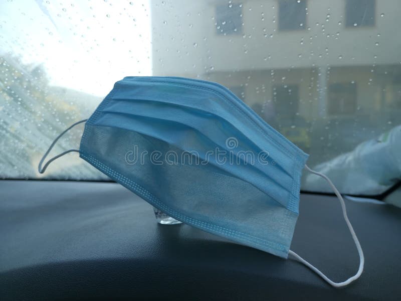 A Blue Face Mask on Car Dashboard. Stock Photo - Image of textile ...