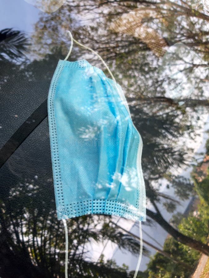 A Blue Face Mask Inside Car Stock Image - Image of black, fresh: 212145593