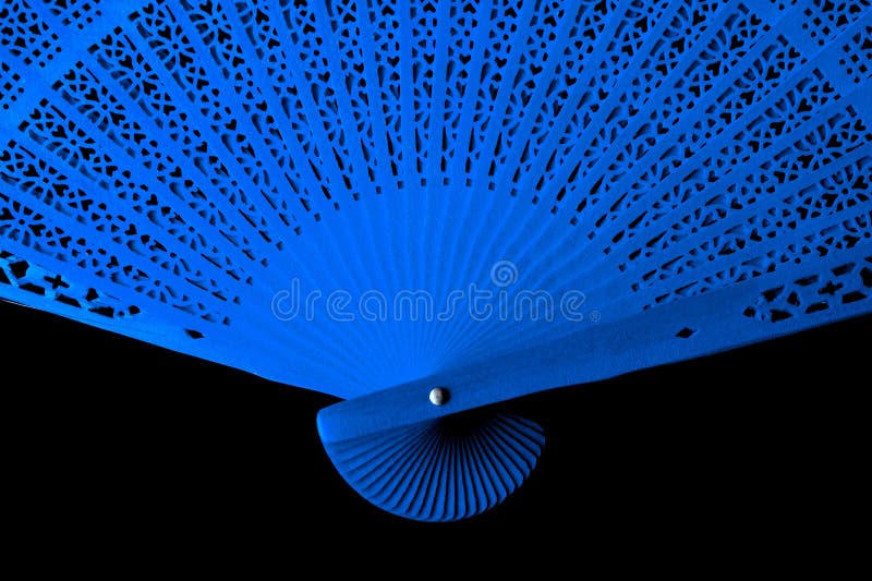Blue Fan with Openwork Pattern Isolated on Black Background Close-up ...