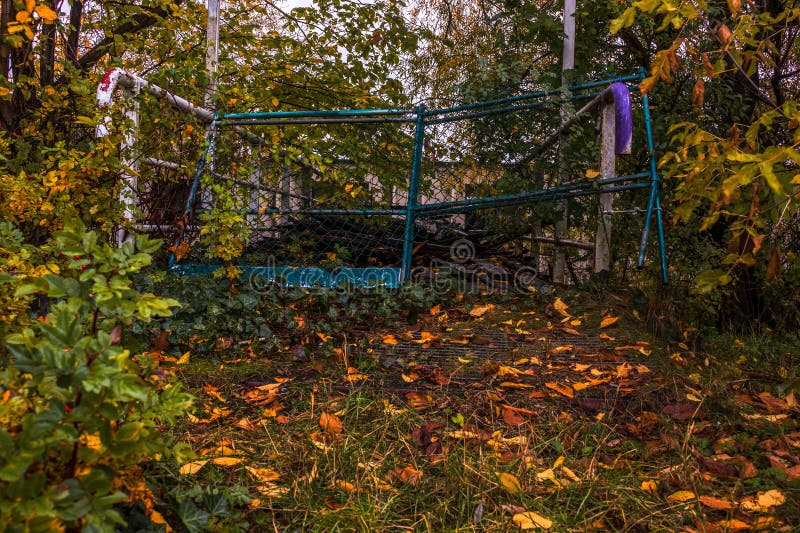 Blue Fence Surrounded by Trees and Bushes Stock Image - Image of bush ...