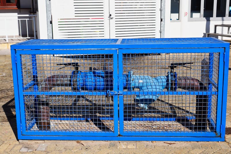 Blue Fire Hydrant in Blue Steel Cage Editorial Photography - Image of ...