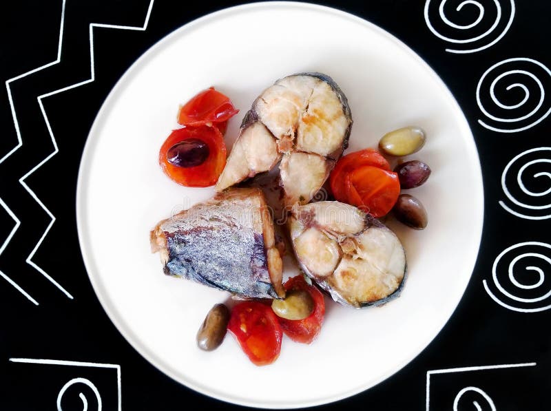 Blue fish cooked in a pan. stock photo. Image of cook - 61926558