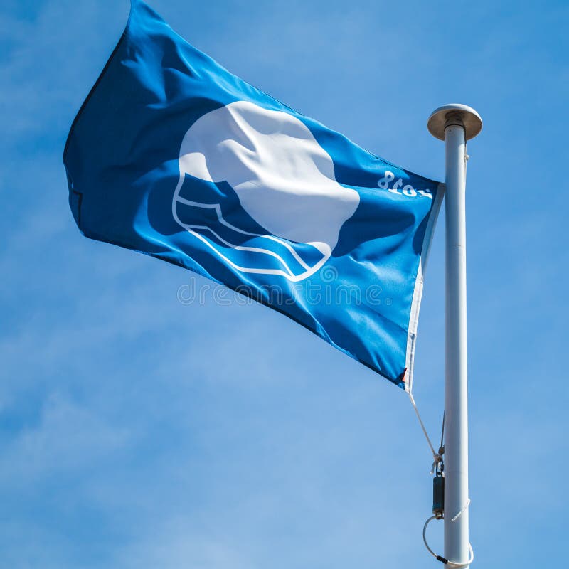 Blue Flag Beach, Flag Over Cloudy Sky Editorial Stock Image - Image of ...