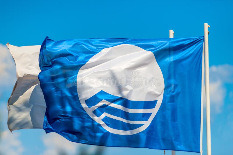 Blue Flag Flying on the Beach Editorial Image - Image of close, flag ...
