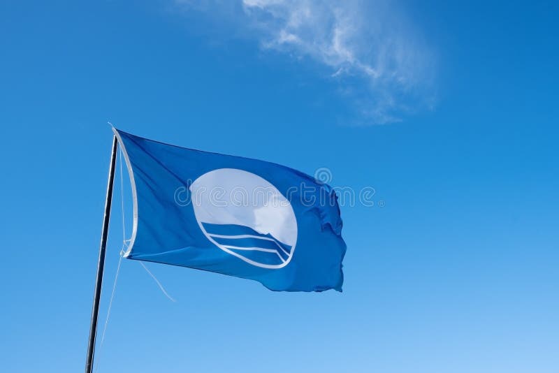 Blue Flag,symbol of Clean Nice Beach Flying on Background of Sky.Copy ...
