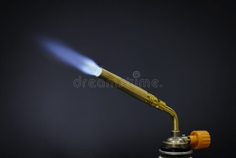 Blue Flame from a Gas Brass Torch Burner on Black Background Stock ...
