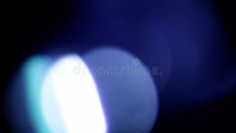 Blue Flashes of Light Defocused Screen Overlay on a Black Background ...