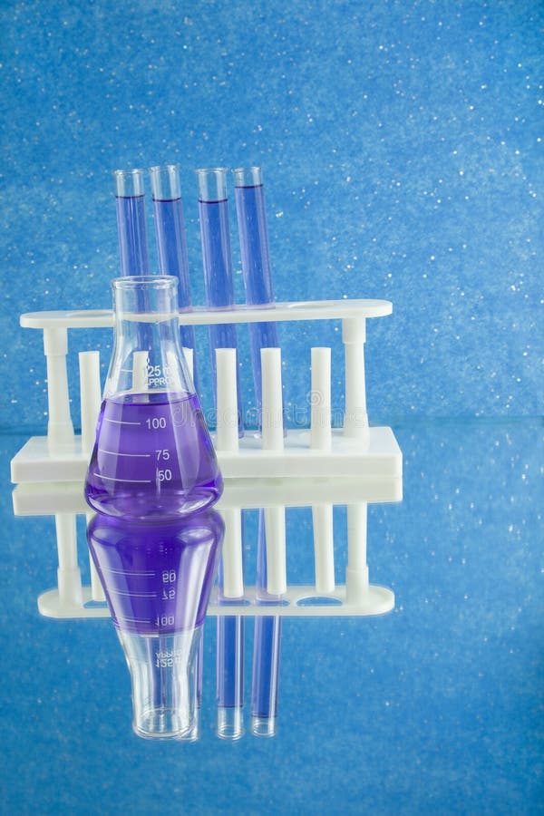 Flask and Test Tubes in Beaker Stock Image - Image of blue, experiment ...