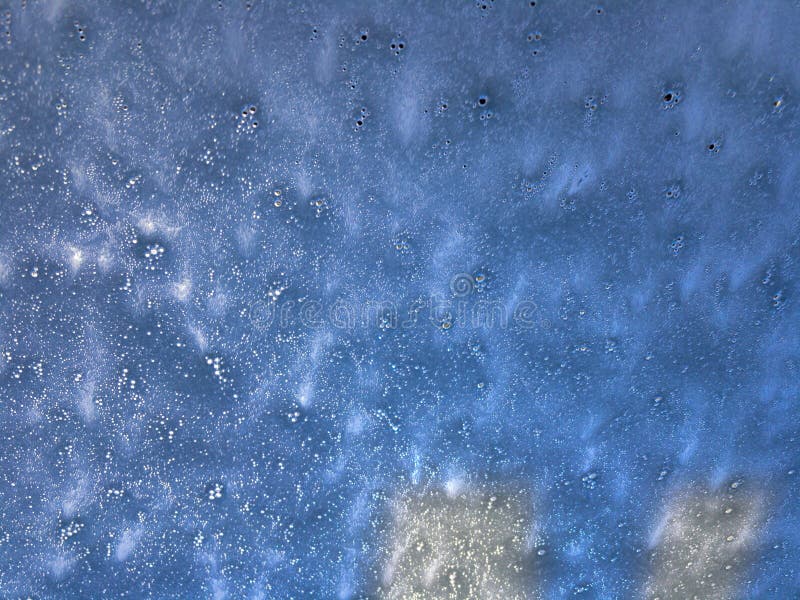 Blue foam on a windshield stock image. Image of wash - 123894979