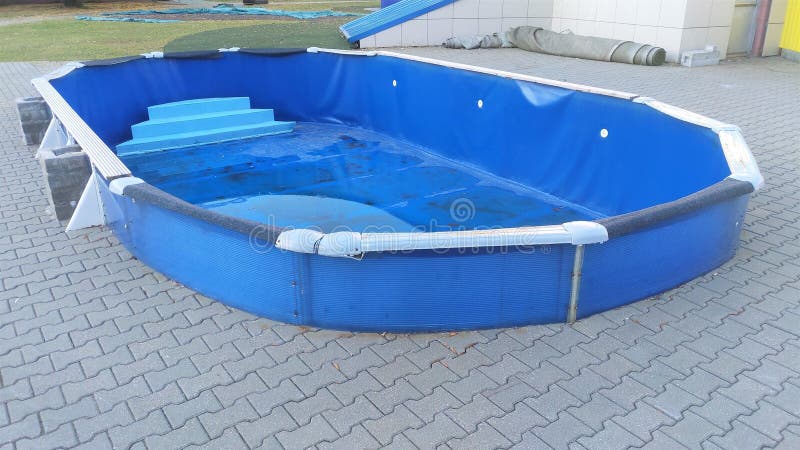 A Blue Frame Swimming Pool Made of PVC Fabric and Plastic is Located on ...