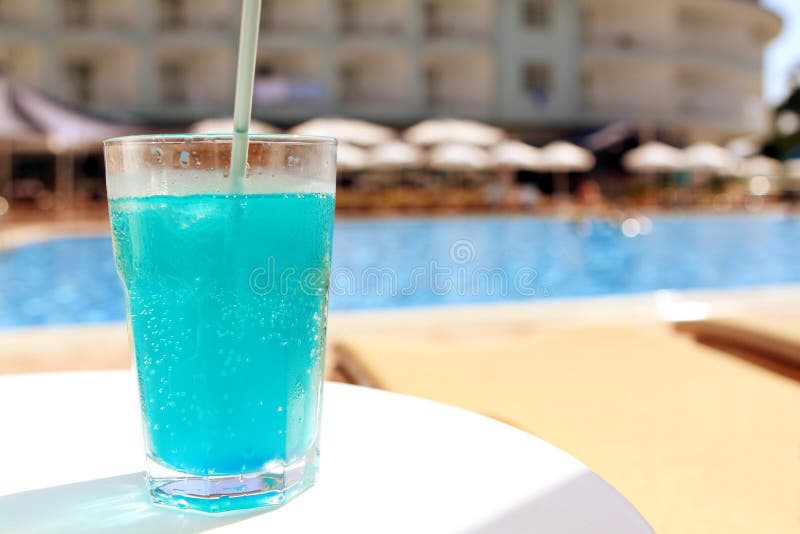 Blue Fruit Cocktail Near Pool on the Table Stock Photo - Image of ...