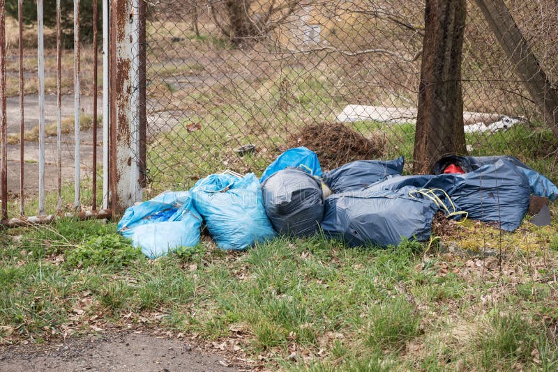 Blue Garbage Bags Full of Trash Next To the Road Stock Photo - Image of ...