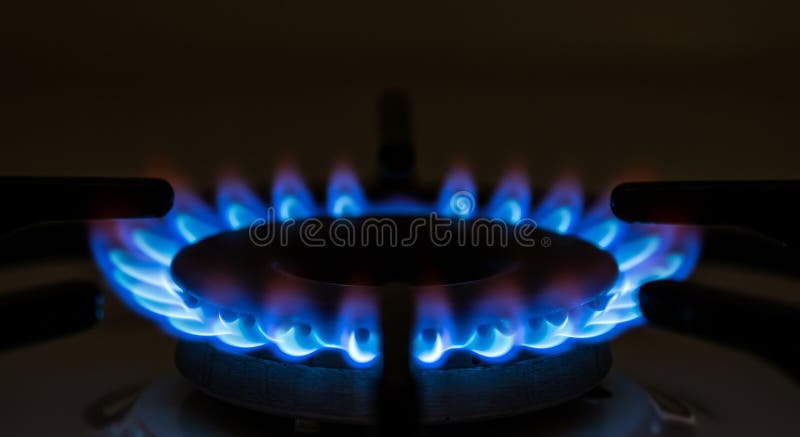 Blue Gas Flame on Stovetop Closeup of a Burning Blue Gas Flame on a ...