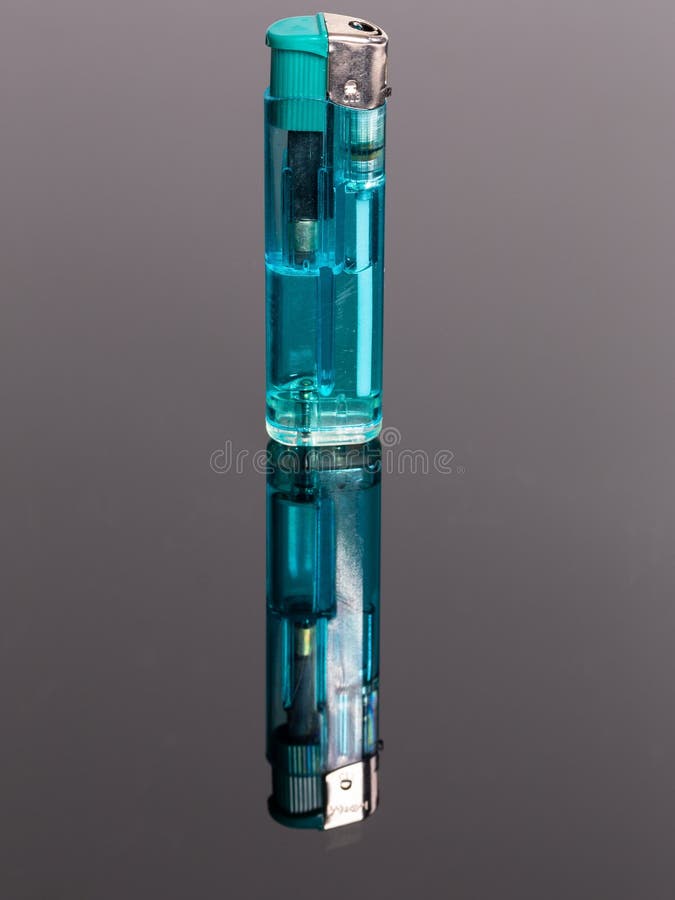 A Blue Gas Lighter on a Grey Reflecting Background Stock Photo - Image ...