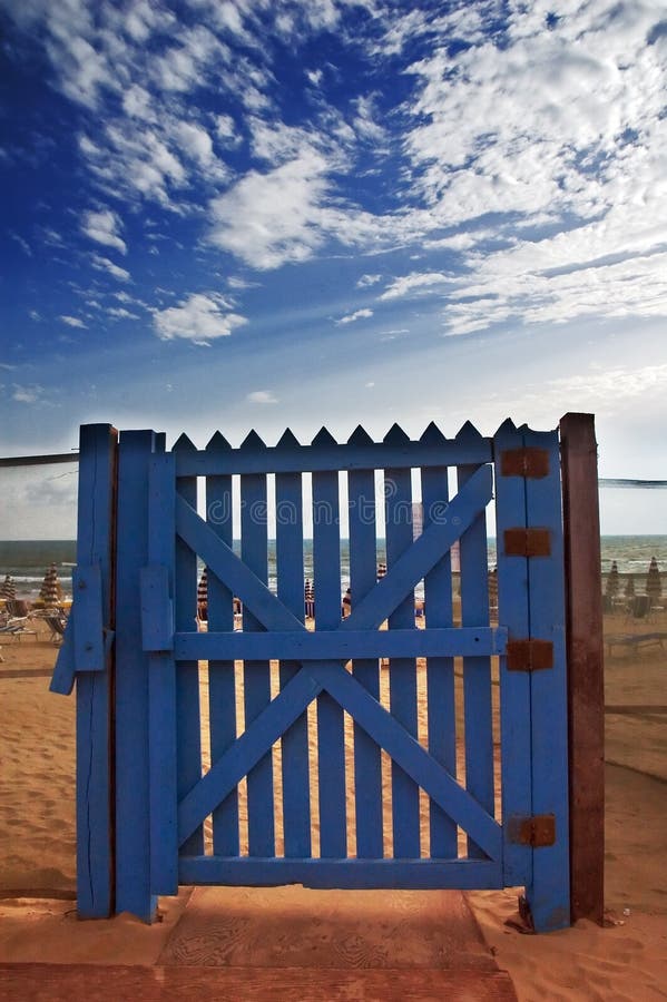 Blue gate on beach stock photo. Image of season, wide - 4978754