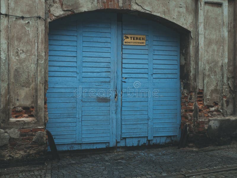 Blue Gate Doors in Ruined Building Editorial Photo - Image of detail ...