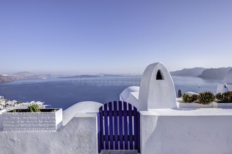 Blue gate in Santorini stock photo. Image of sunburst - 202571516