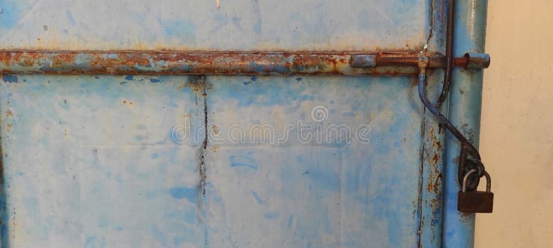 The Blue Gate is Starting To Rust with a Manual Lock System Stock Image ...