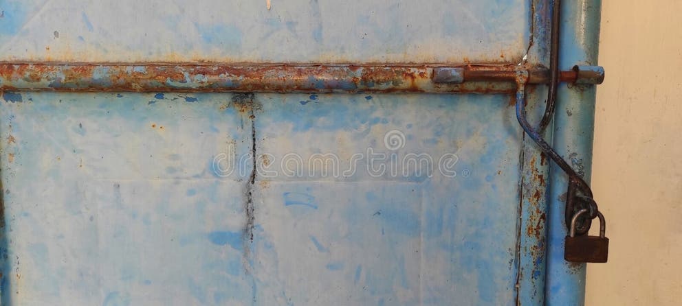 The Blue Gate is Starting To Rust with a Manual Lock System Stock Image ...