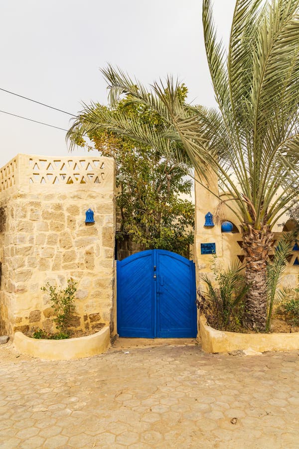Blue Gate in a Stone Wall in Egypt Stock Image - Image of stone, people ...