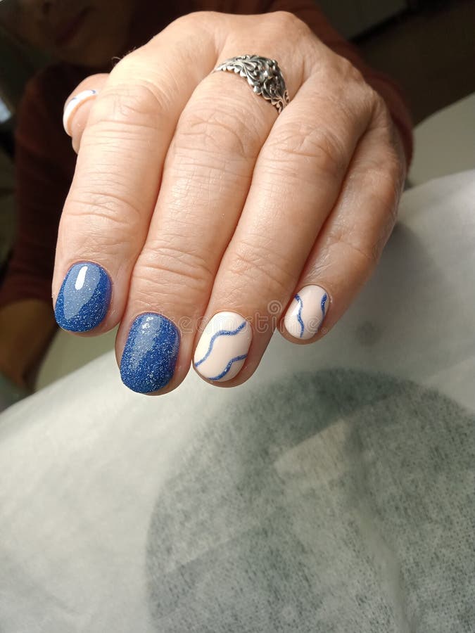 Blue gel nail polish stock image. Image of blue, nail - 260588405