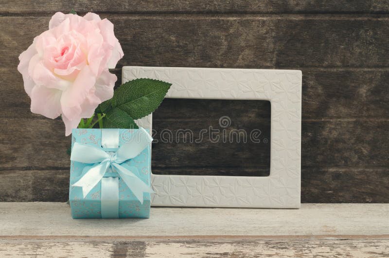 Blue Gift Box with Blank Frame and Oink Rose Stock Image - Image of ...