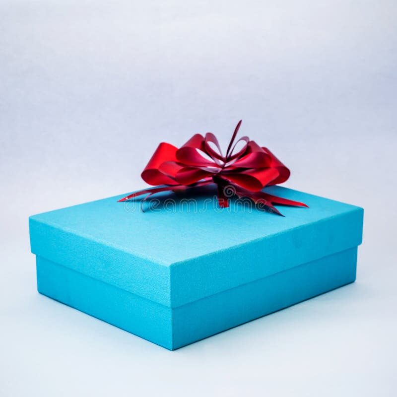 Blue Gift Box with Red Ribbon on Wood Stock Photo - Image of pledge ...