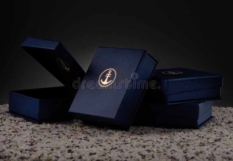 Blue Gift Boxes with Golden Anchor on Sea Pebbles Stock Photo - Image ...