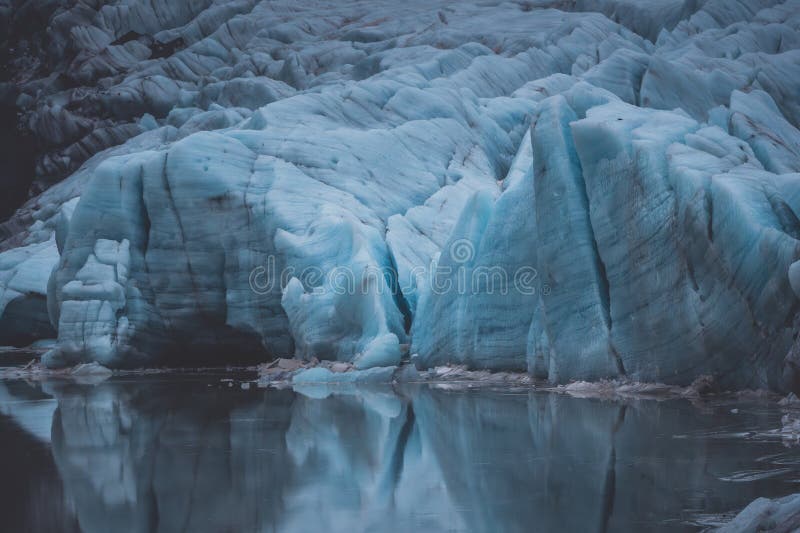 Blue Glacier Ice Formations Reflecting in Meltwater Stock Photo - Image of melting, nature ...