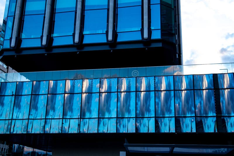 Blue Glass Facade with Sky Reflection. a Modern Architectural Building ...