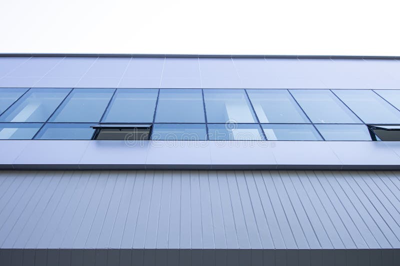 Blue Glass Windows Installed in New Buildings. Stock Image - Image of ...